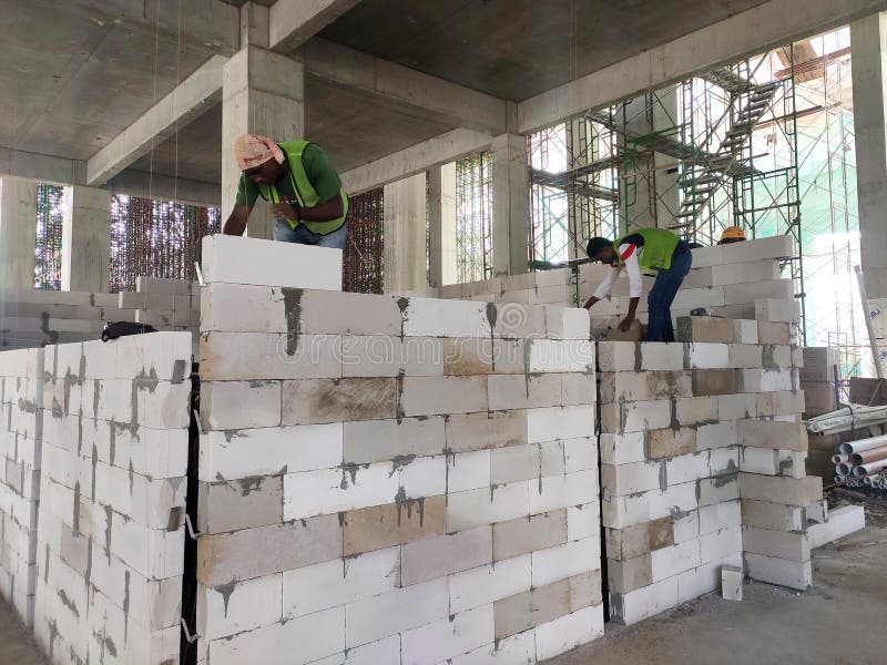 Blockwork by Construction Workers at the Construction Site. Editorial ...