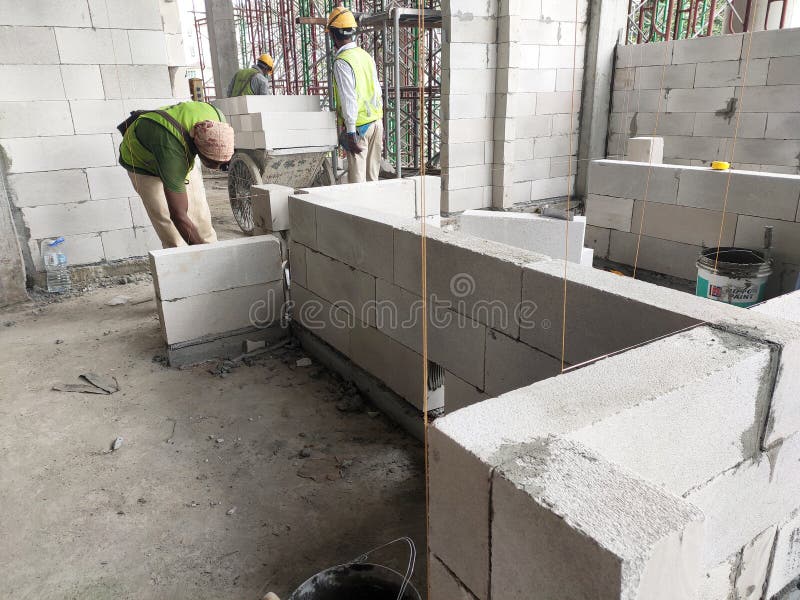 Construction Workers Fabricating Timber Column Formwork at the ...
