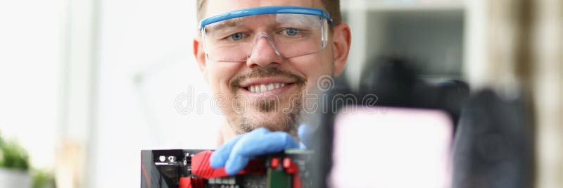 Blogger Demonstrates on Camera Repair of Computer Board Stock Image ...