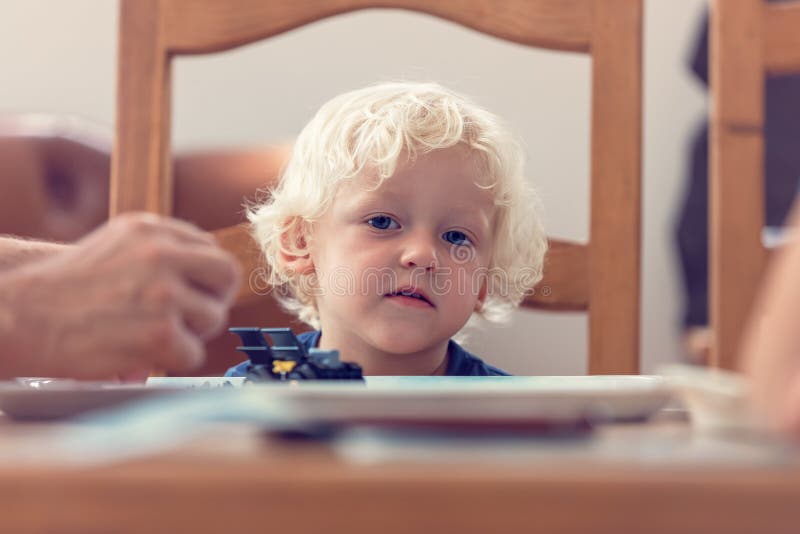 Blond Boy Playing at the Table Stock Photo - Image of family, aged ...