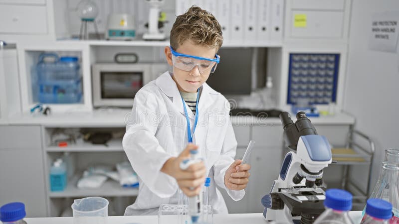 Blond Boy Scientist Doing Experiment at Laboratory Stock Image - Image ...