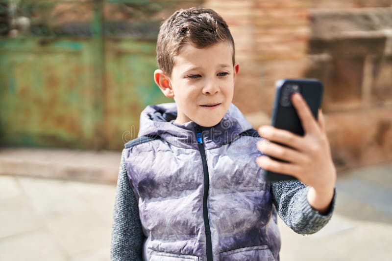 Blond Child Smiling Confident Having Video Call at Street Stock Photo ...