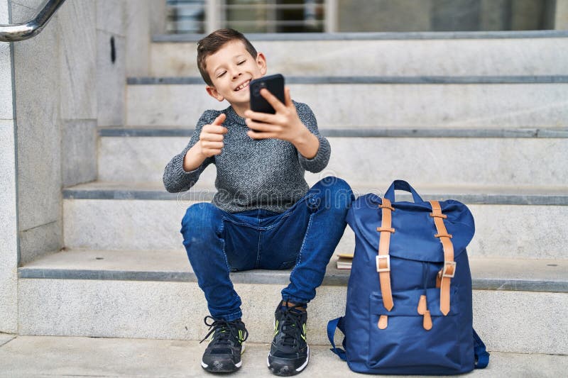 Blond Child Student Having Video Call Sitting on Stairs at School Stock ...