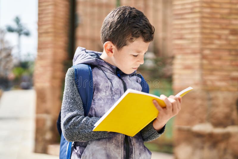 Blond Child Student Reading Book Standing at Street Stock Photo - Image ...