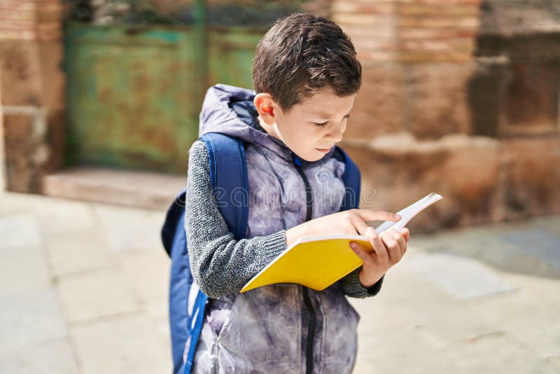Blond Child Student Reading Book Standing at Street Stock Photo - Image ...