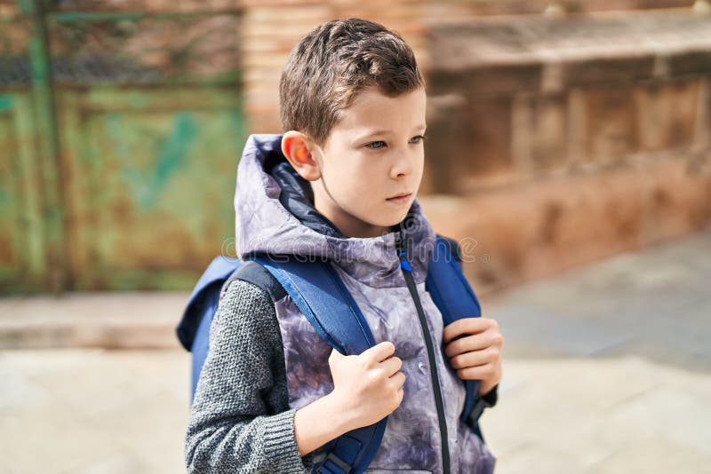 Blond Child Student Standing with Serious Expression at Street Stock ...