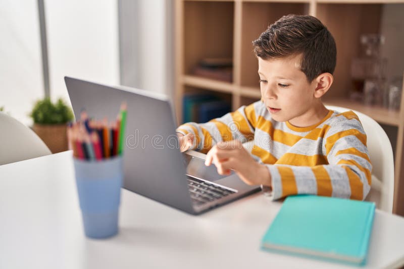 Blond Child Studying Sitting on Table at Home Stock Photo - Image of ...