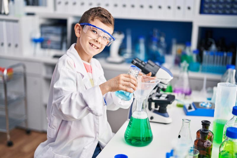 Blond Child Wearing Scientist Uniform Measuring Liquid at Laboratory ...
