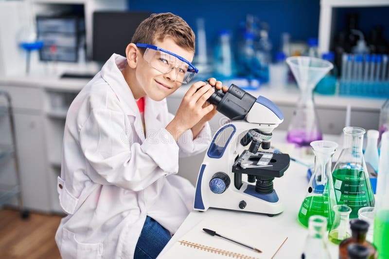 Blond Child Wearing Scientist Uniform Using Microscope at Laboratory ...