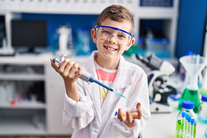 Blond Child Wearing Scientist Uniform Using Pipette at Laboratory Stock ...