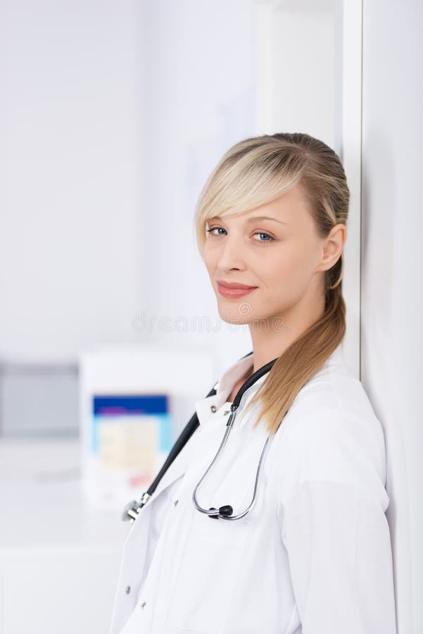 Blond Doctor Wearing Gloves Stock Image - Image of calm, doctor: 12112315