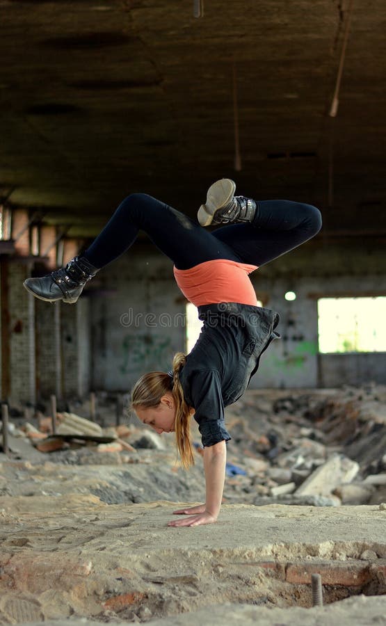 Blond Girl Dancing Break Dance in the Old Brickworks Stock Photo ...