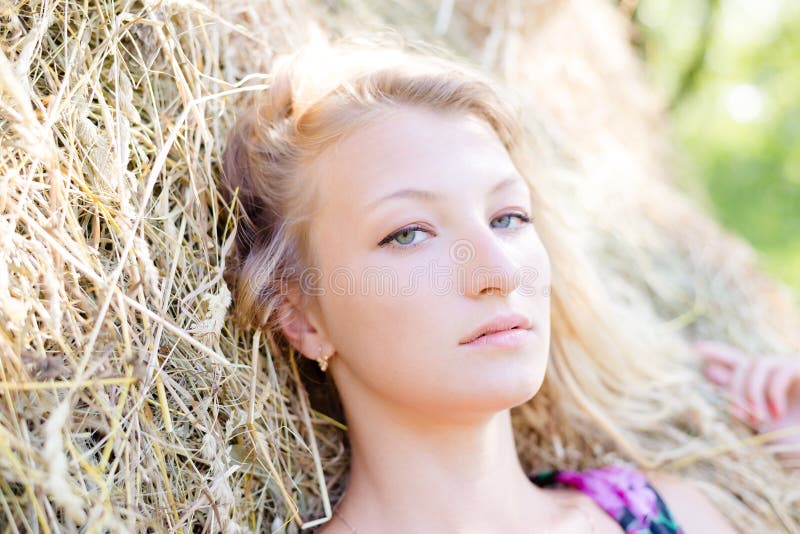 Blond Girl is Lying on Haystack in Summer Sunny Stock Photo - Image of ...