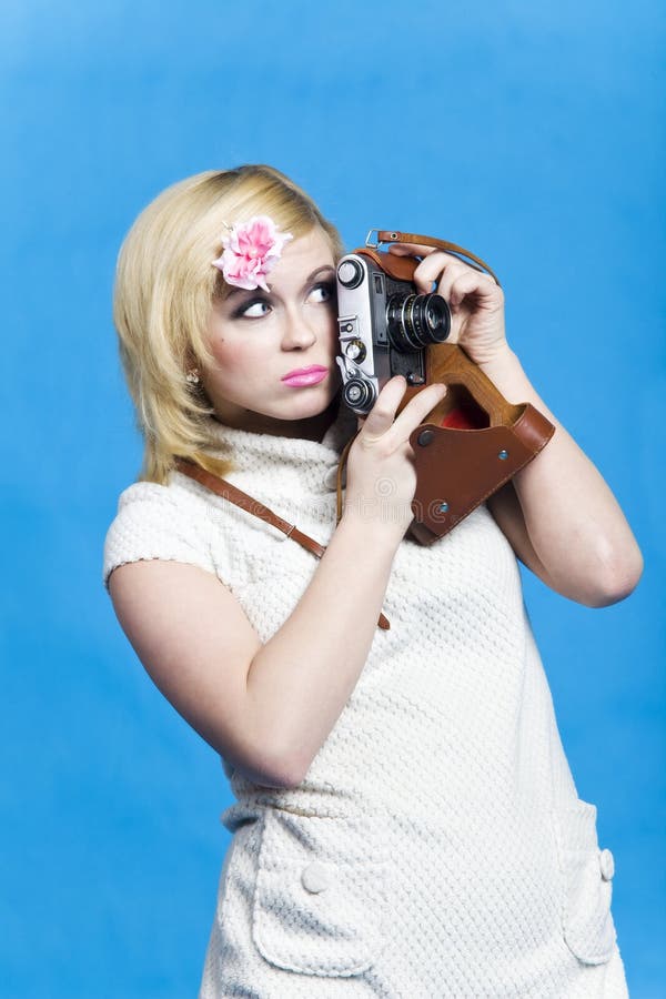 Blond Girl with Retro Camera Look Aside Stock Photo - Image of blond ...