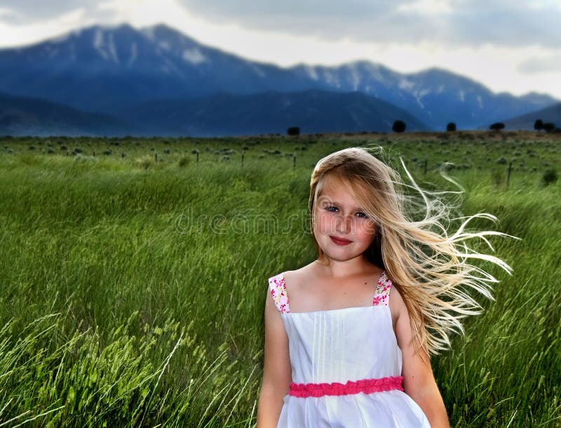 A Blond Girl with Wind Blowing through Her Hair Stock Image - Image of ...