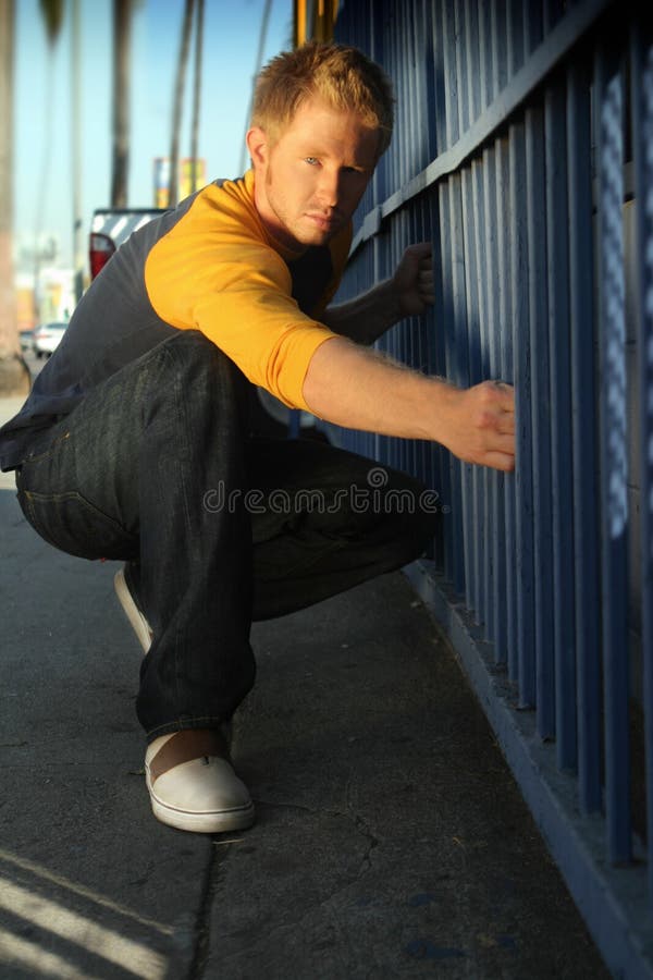 Crouching guy stock image. Image of real, portrait, human - 12001735