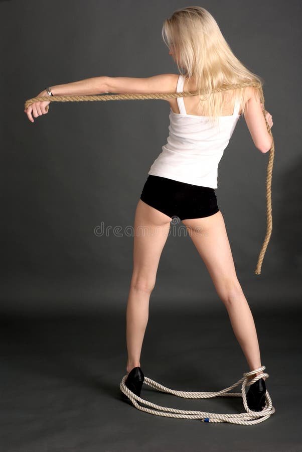 Woman tied up with a rope stock photo. Image of social - 20460668