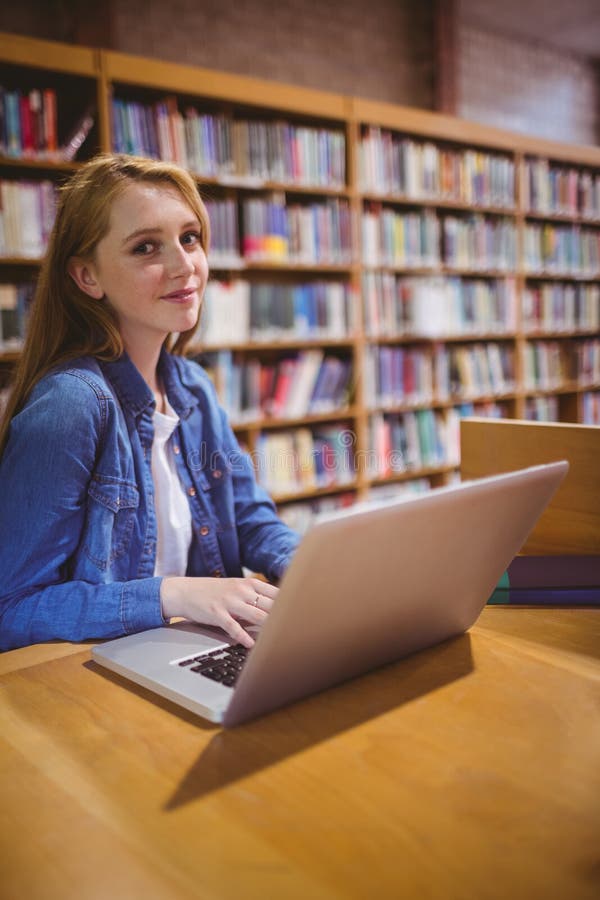 Blond Student Using Laptop in Library Stock Image - Image of school ...