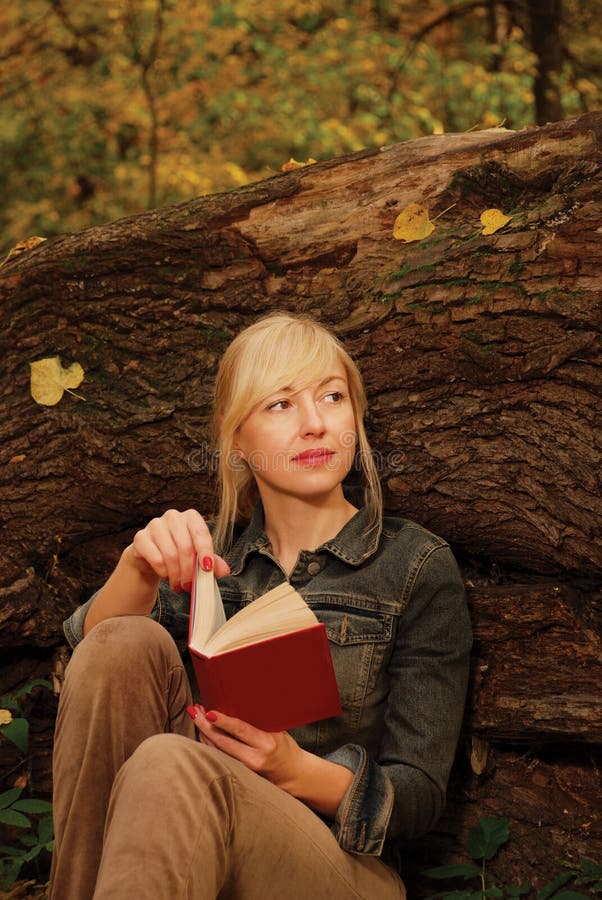 Blond Woman with a Book by a Tree Stock Image - Image of outdoors ...