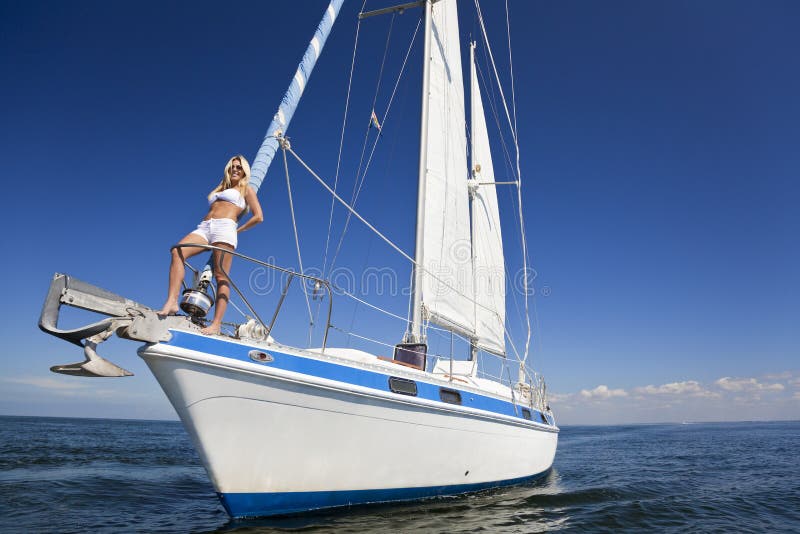 Blond Woman on the Bow of a Sail Boat Stock Photo - Image of solitude ...