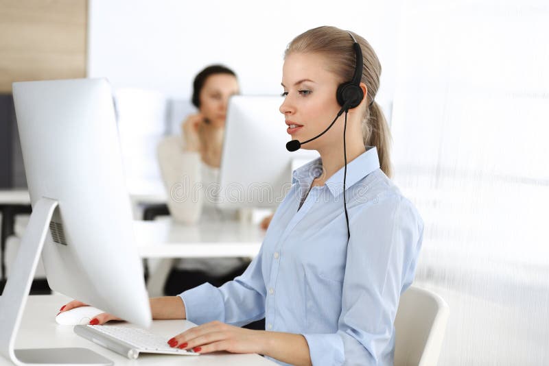 Blond Woman Call Operator is Using Computer and Headset for Consulting ...