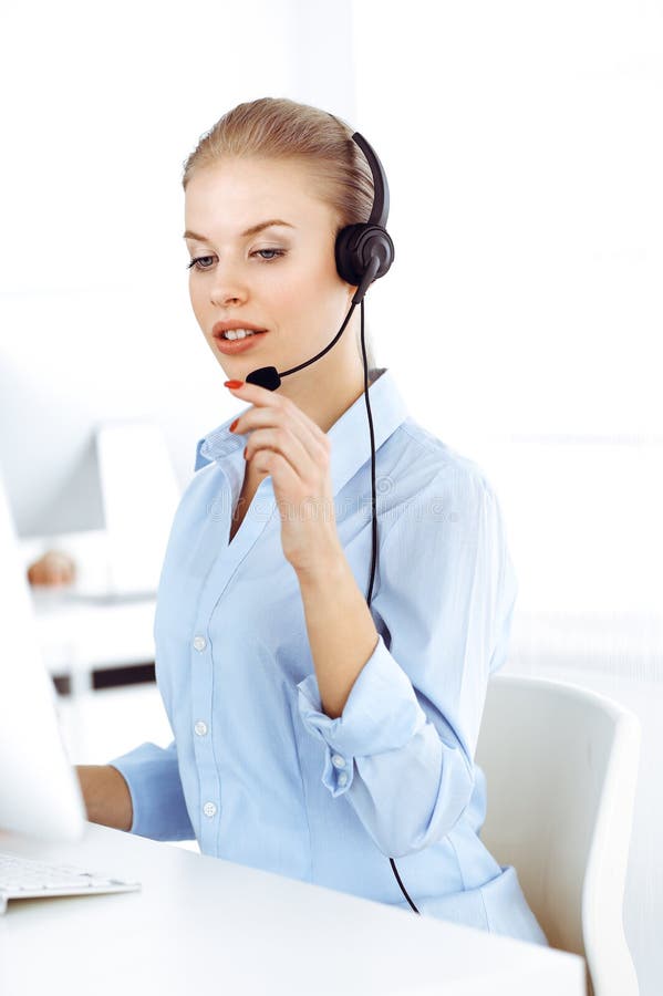 Blond Woman Call Operator is Using Computer and Headset for Consulting ...