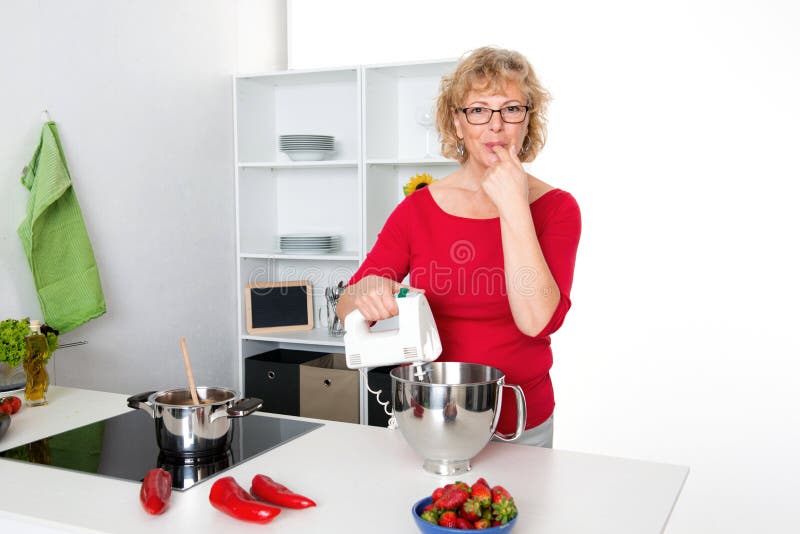 Blond Woman Cooking and Baking in the Kitchen Stock Image - Image of ...