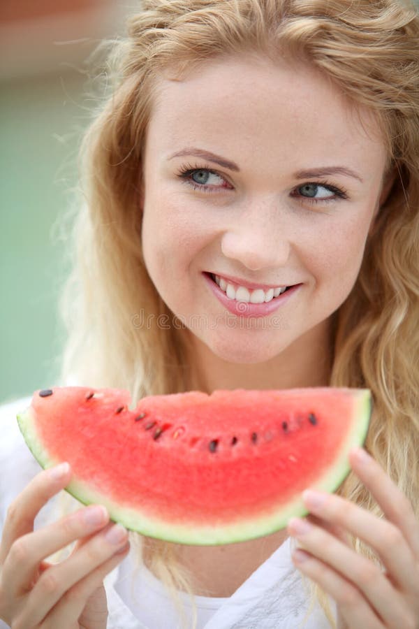 Blond Woman Eating Watermelon Stock Photo - Image of long, blond: 22025240