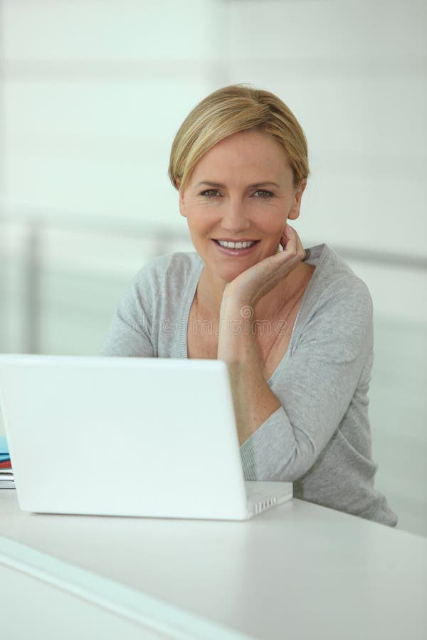 Blond Woman in Front of Computer Stock Image - Image of neckline ...