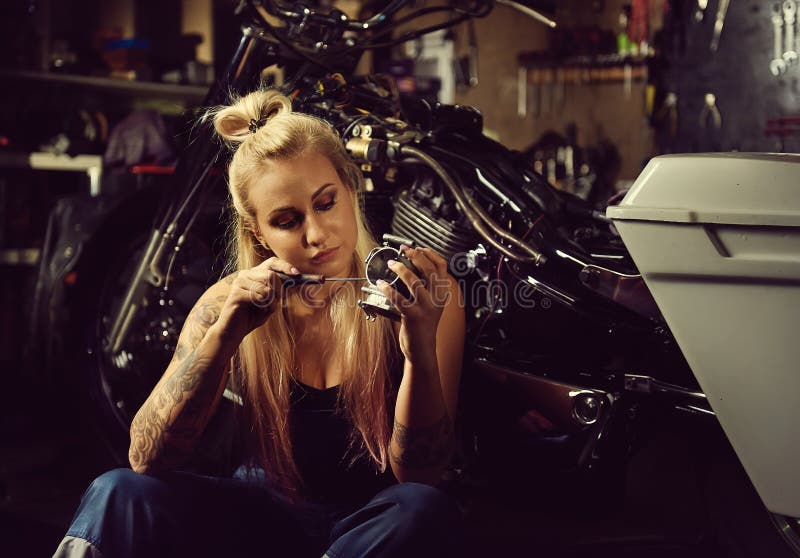 Blond woman mechanic stock photo. Image of motorbike - 78357992