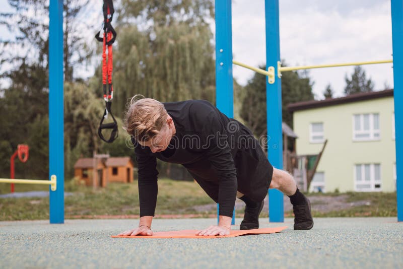Blonde Athlete Performs an Exercise Called a Push-up. a Heavy Intense ...