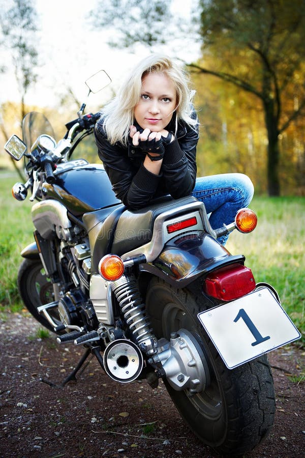 One blonde on a motorcycle stock image. Image of athletic - 11430517