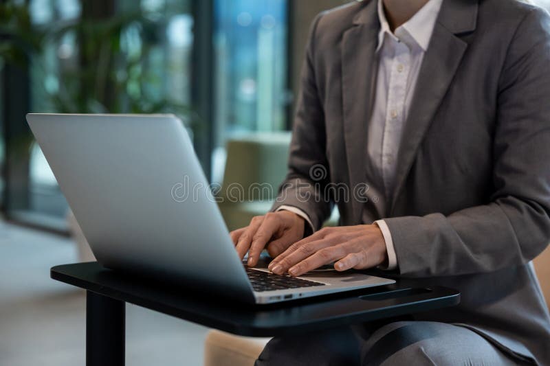 Blonde Business Woman Sitting with a Laptop and Working Stock Image ...