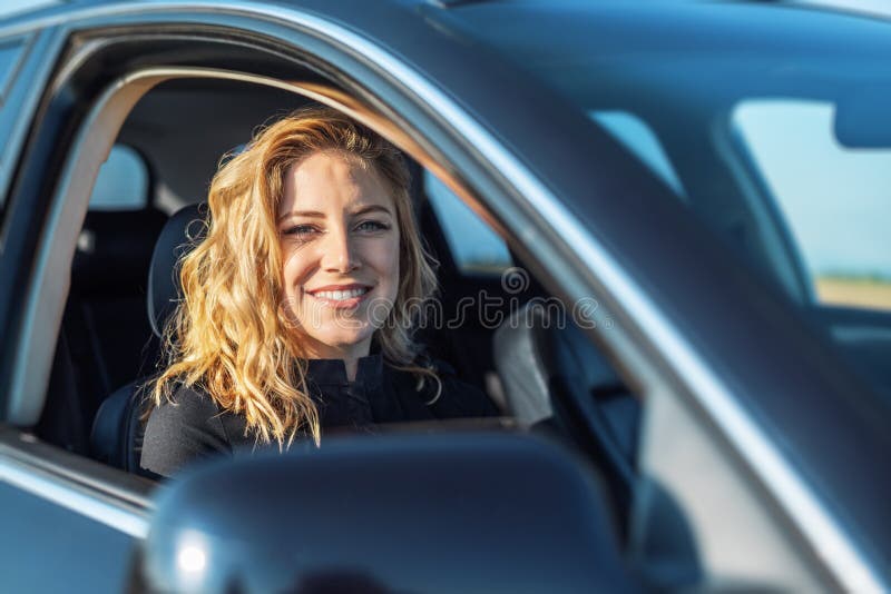 Blonde in the Car. Attractive Woman Drives a Car Stock Image - Image of ...