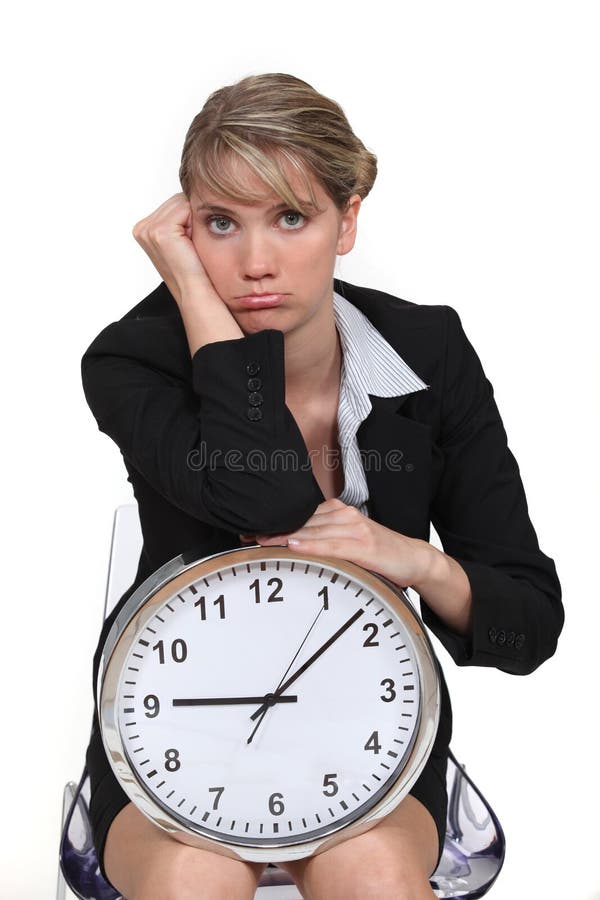 Blonde with Clock Looking Bored Stock Image - Image of boredom ...