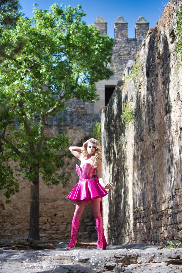 Blonde Drag Queen Dressed in Pink in a Medieval Castle Poses and Makes ...