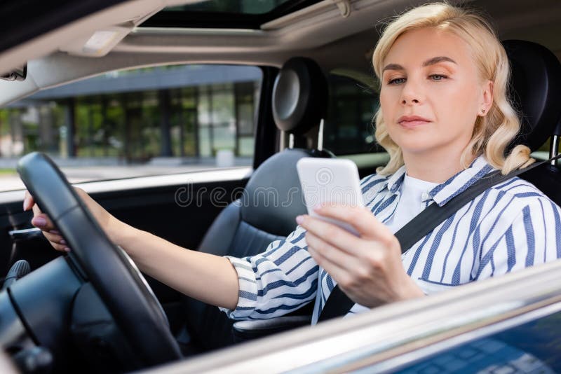 Blonde Driving Using Smartphone while Driving Stock Image - Image of ...