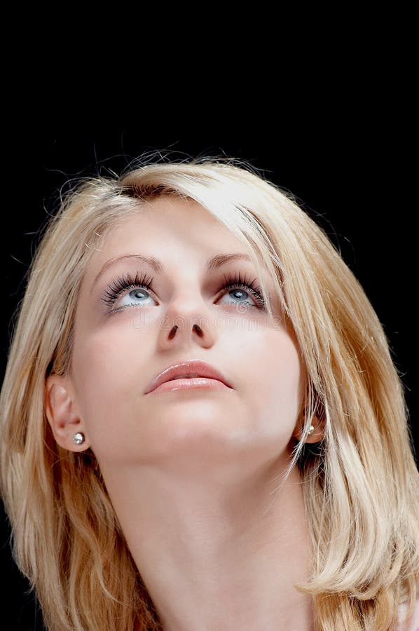 Blonde girl looking up stock photo. Image of expression - 990244