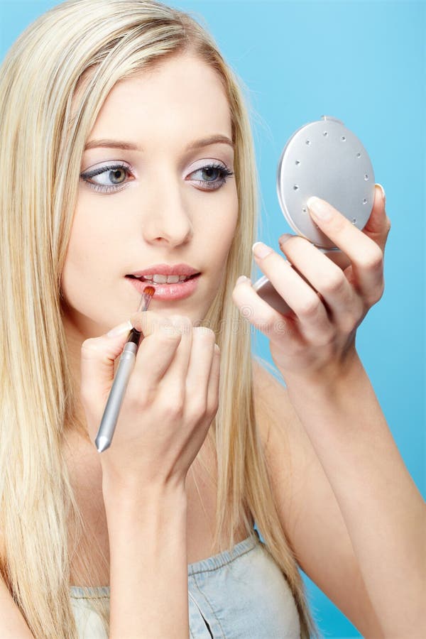 Blonde girl making up stock photo. Image of blue, female - 15074060