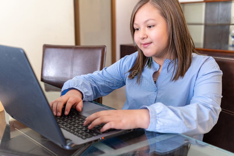 Blonde Girl Taking Internet Classes on a Computer at Home Stock Photo ...