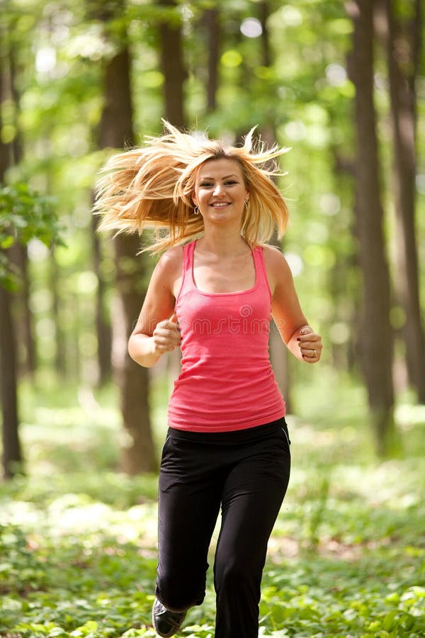 Blonde lady running stock image. Image of outdoor, female - 14540325