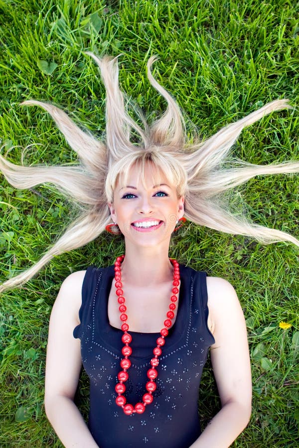 The Blonde Laying on a Grass with Scattered Hair Stock Photo - Image of ...
