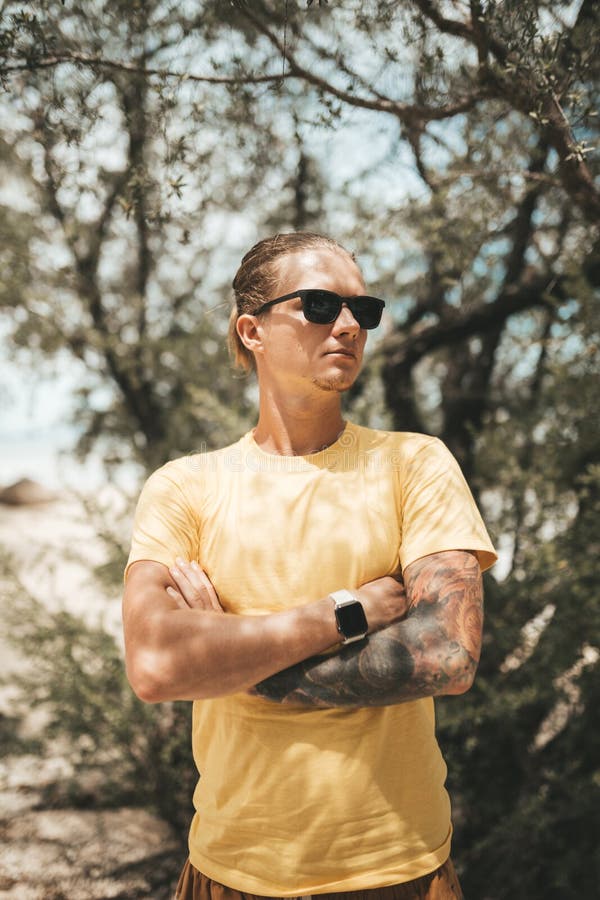 Blonde Man with Pony Tail Standing on the Beach Stock Image - Image of ...