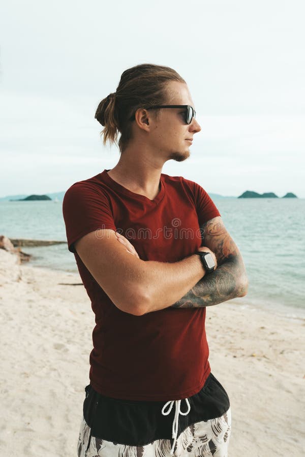Blonde Man with Pony Tail Standing on the Beach Stock Image - Image of ...
