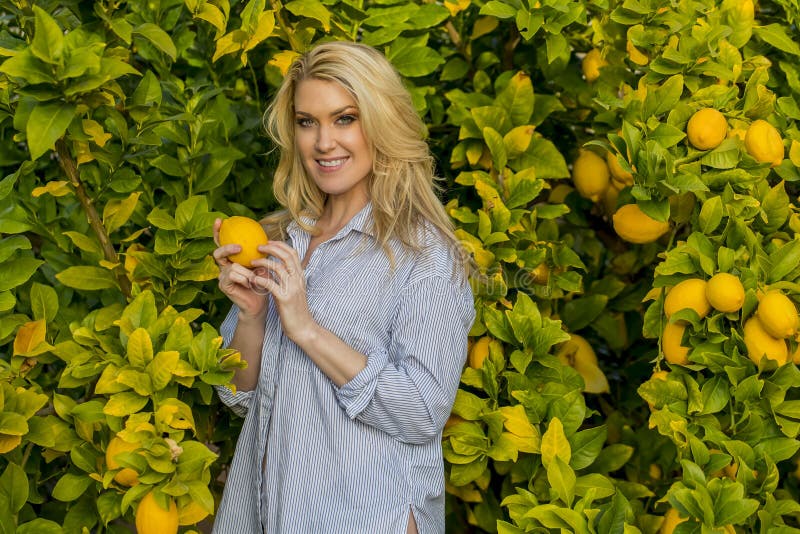 Blonde Outdoor Model with Fruit Tree Stock Photo - Image of fashionable ...