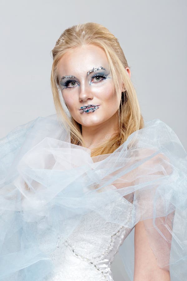Blonde in a White Dress with Blue Makeup. the Snow Queen. Stock Photo ...