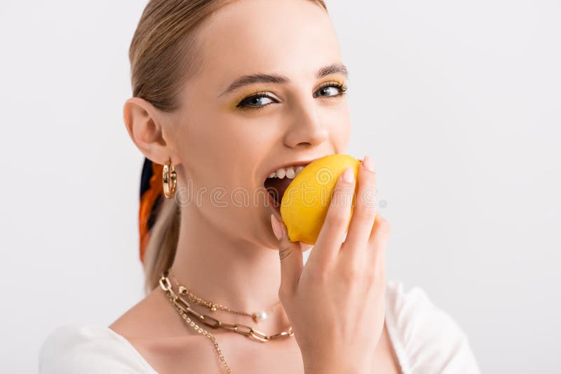 Blonde Woman Biting Yellow Lemon Isolated Stock Photo - Image of citrus ...