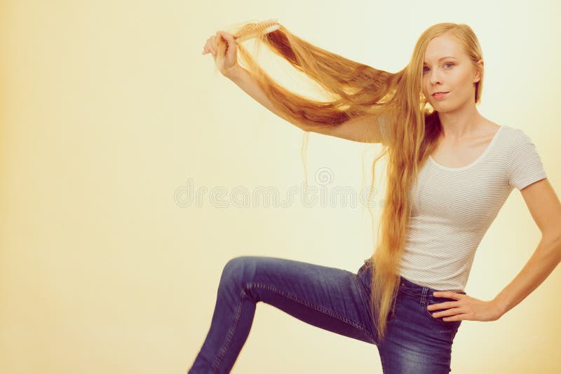 Blonde Girl Brushing Her Long Hair Stock Image Image Of Girl