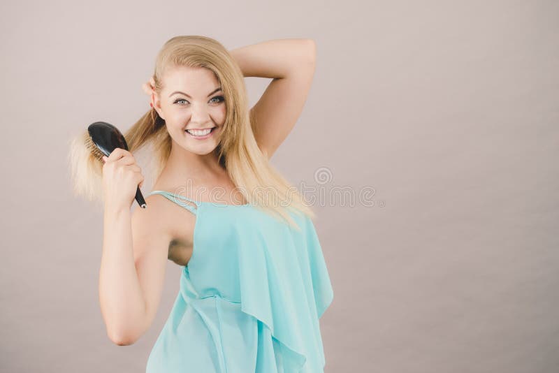 Blonde Woman Brushing Her Long Hair Stock Image Image Of Conditioner
