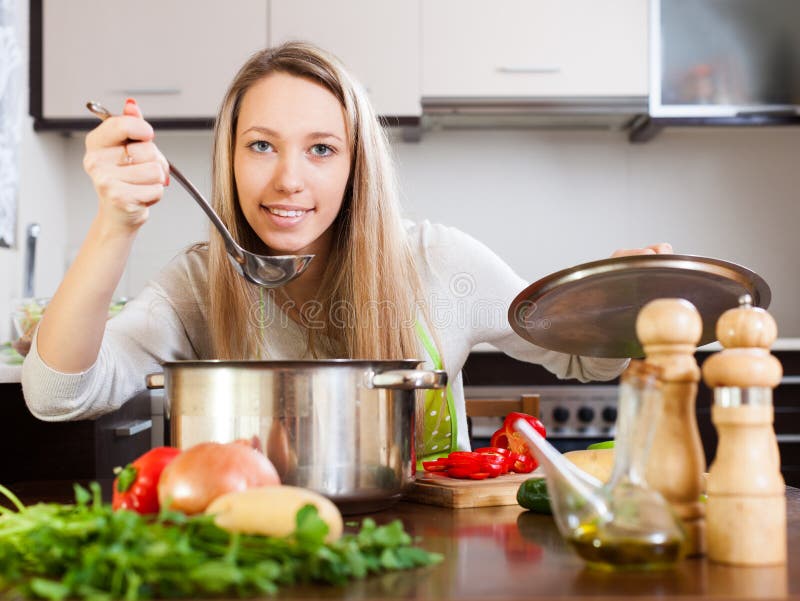 Home Cook Woman in Red Apron at Domestic Kitchen Holding Cooking Pot ...